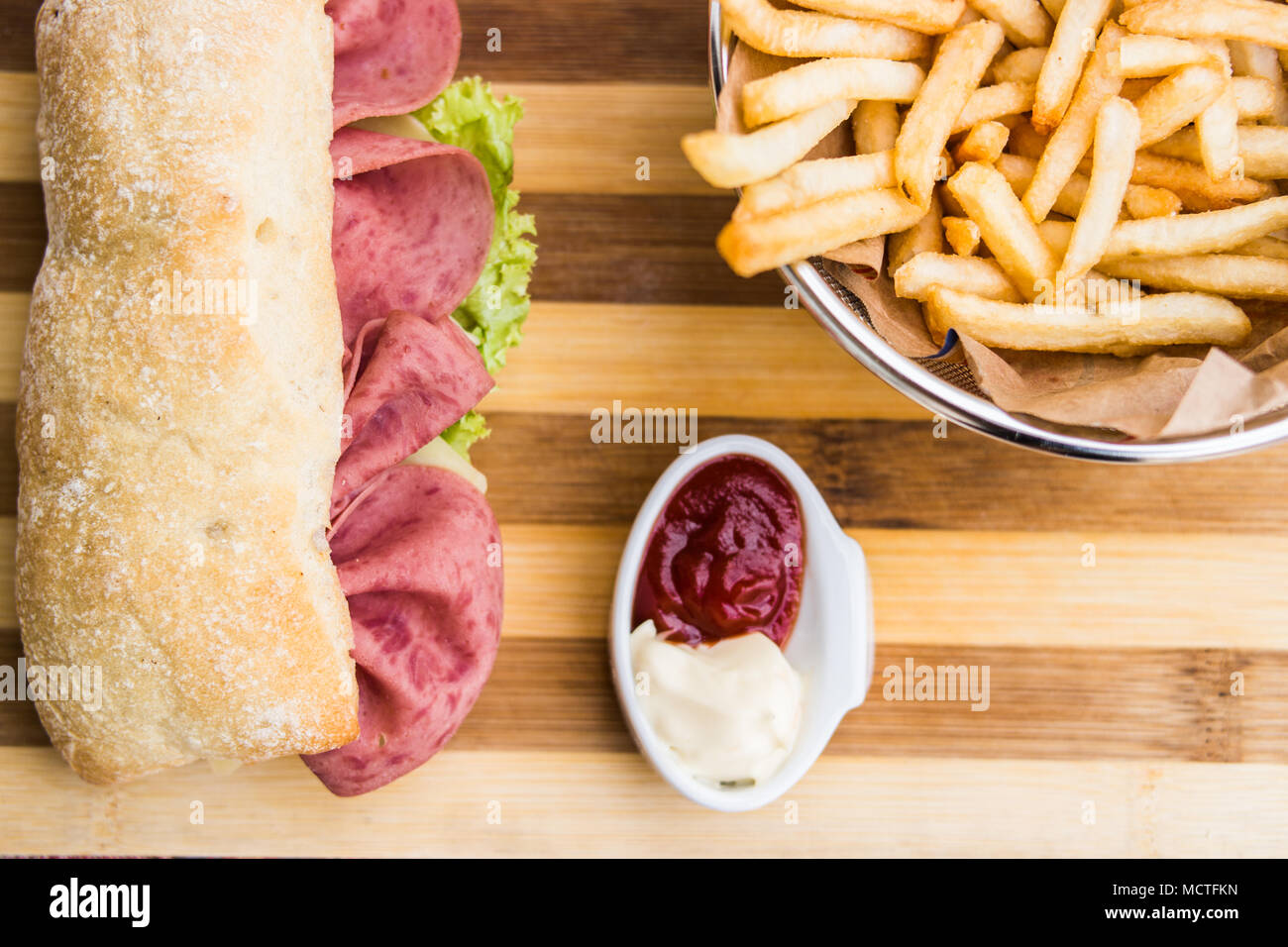 homemade ham sandwich with fried potatoes (French fries), ketchup and ...
