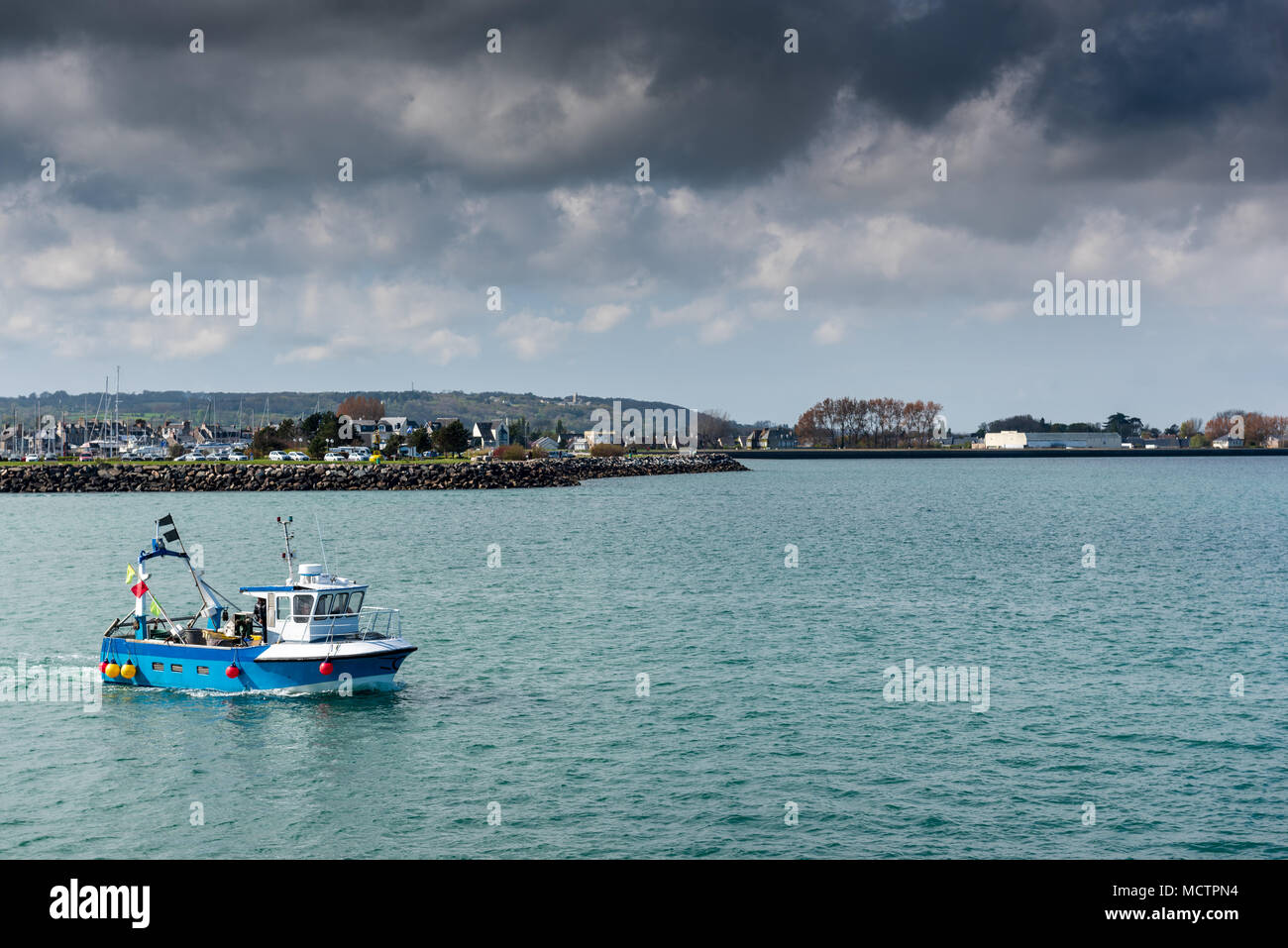 Fishing boat leaving the harbor of Barfleur, France Stock Photo - Alamy