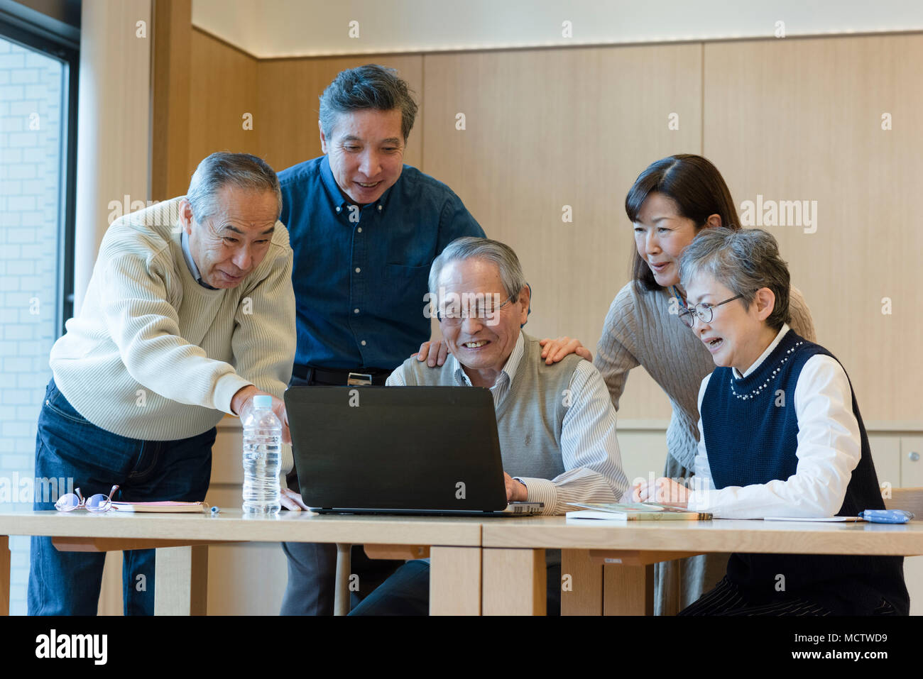 Senior people enjoying using PC Stock Photo - Alamy