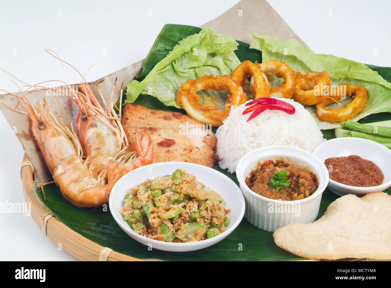 Indonesian traditional food, chicken, fish, vegetables Stock Photo - Alamy