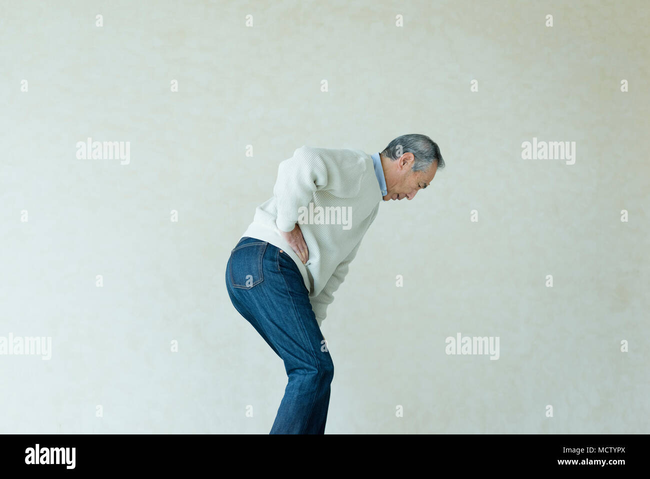 Bend over pain hi-res stock photography and images - Alamy