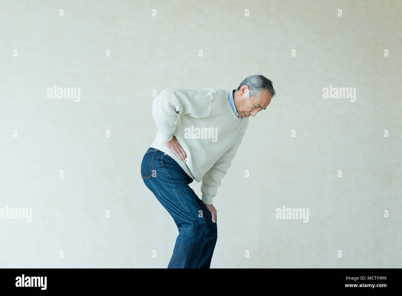 Senior man with backache Stock Photo - Alamy