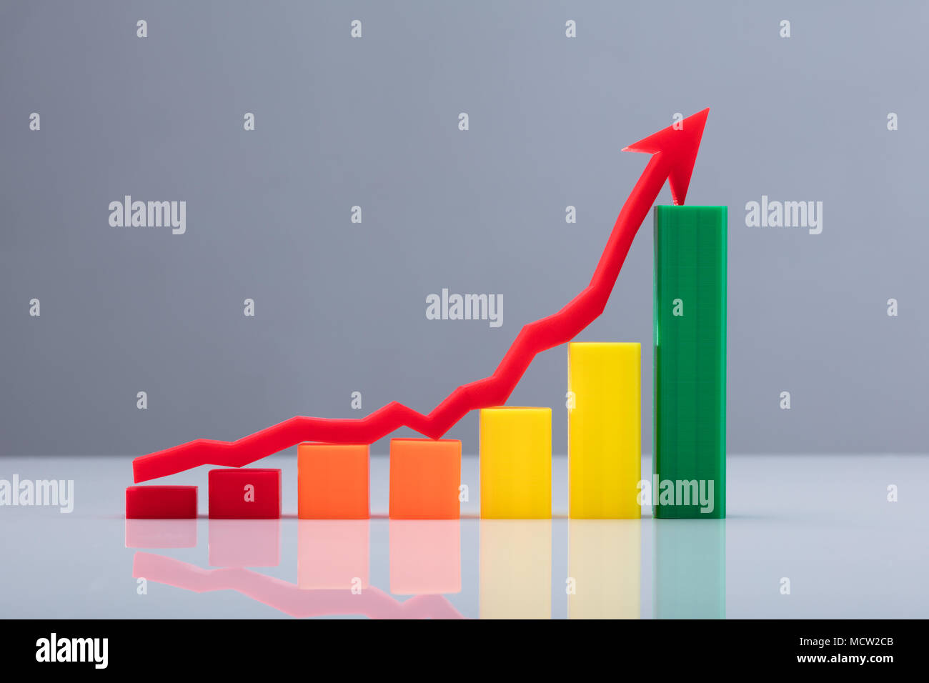 Multi Colored Business Graph With Red Arrow Sign Showing Upward ...