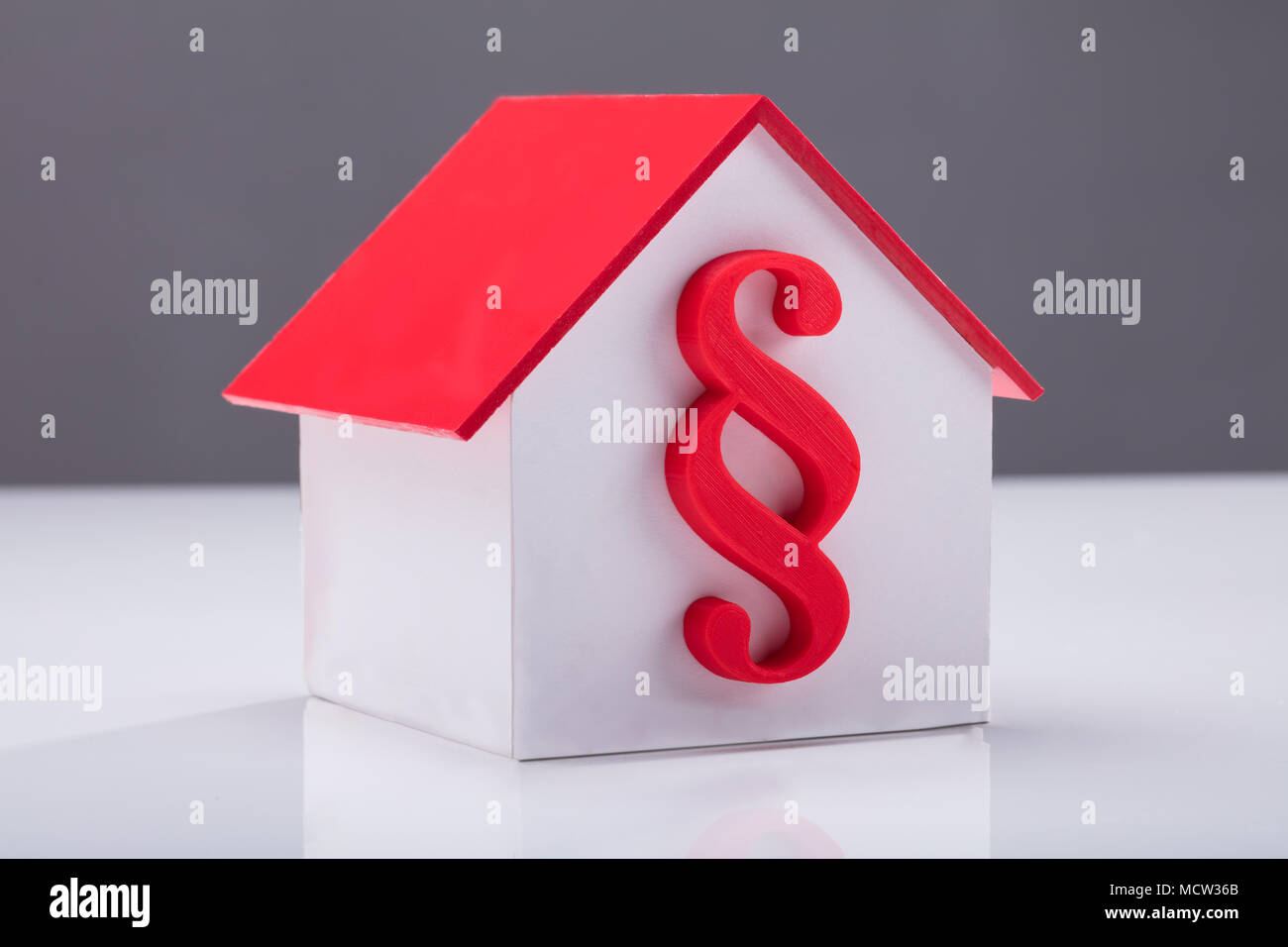 Close-up Of A House Model With Paragraph Symbol Stock Photo - Alamy