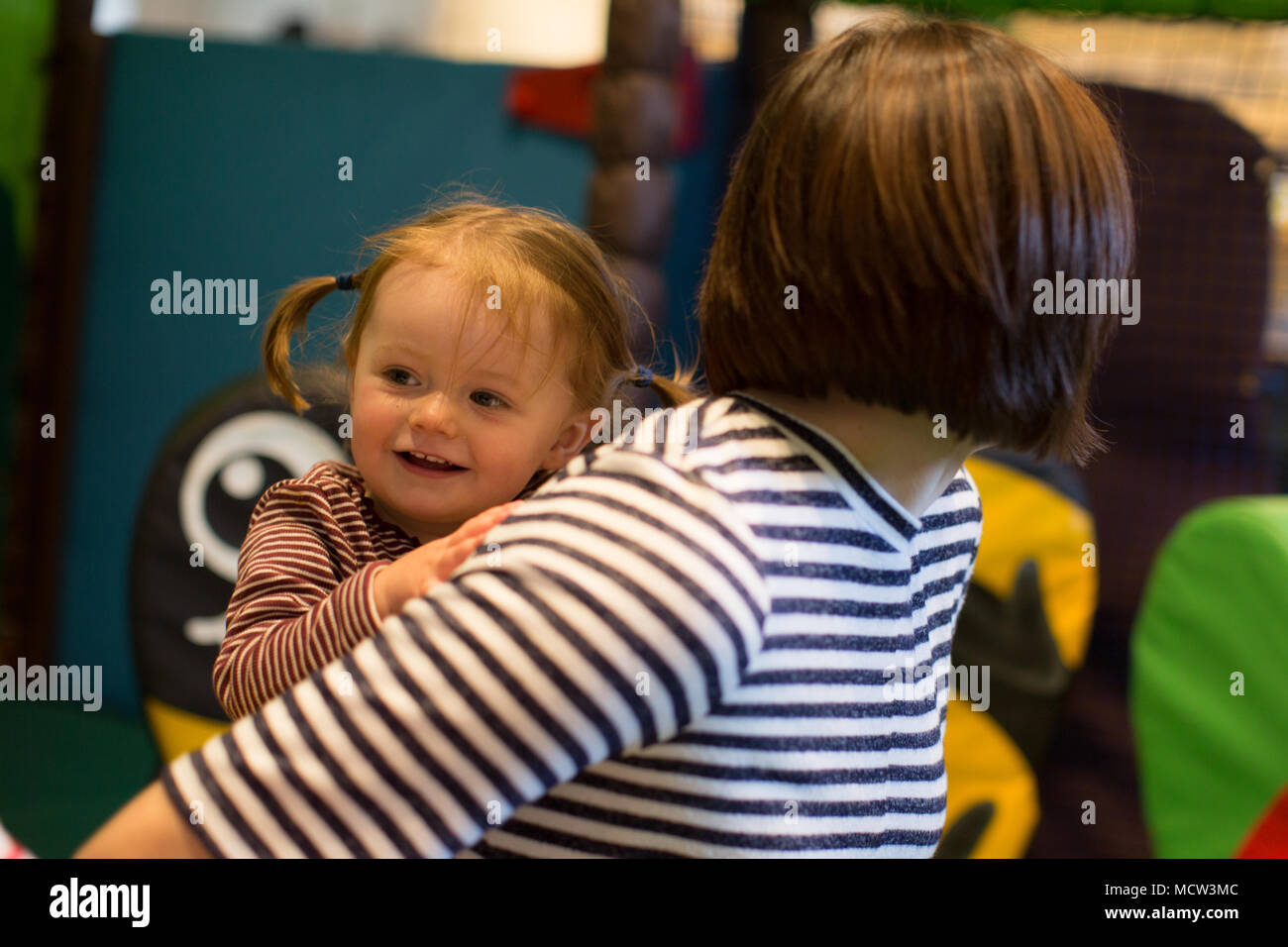 Mum and child having fun at a playgroup Stock Photo - Alamy