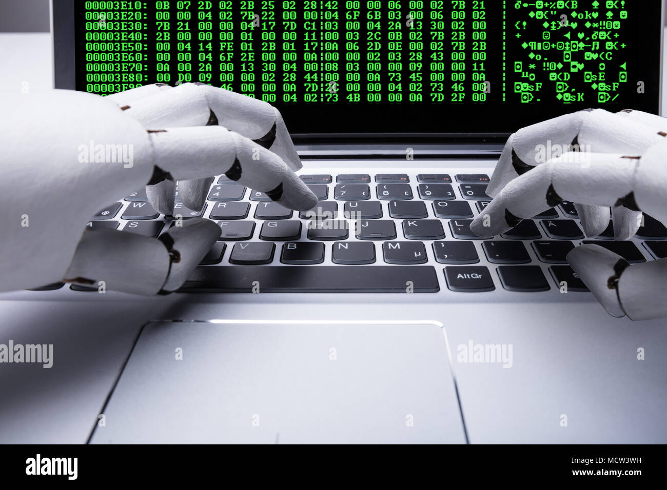Robotic Hand Working On Laptop With Binary Code On Screen Stock Photo ...
