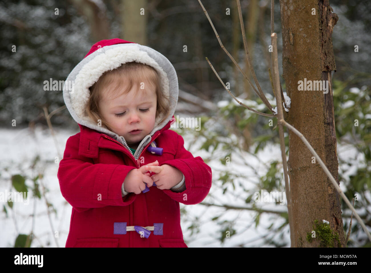 Child touching snow hi-res stock photography and images - Alamy