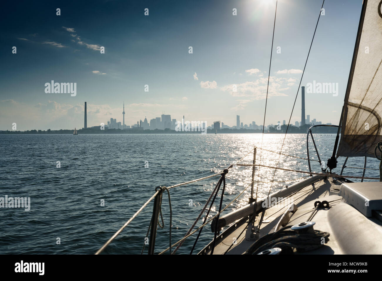 Sailboat and Lake Ontario with city skyline at distant, Toronto, Canada ...