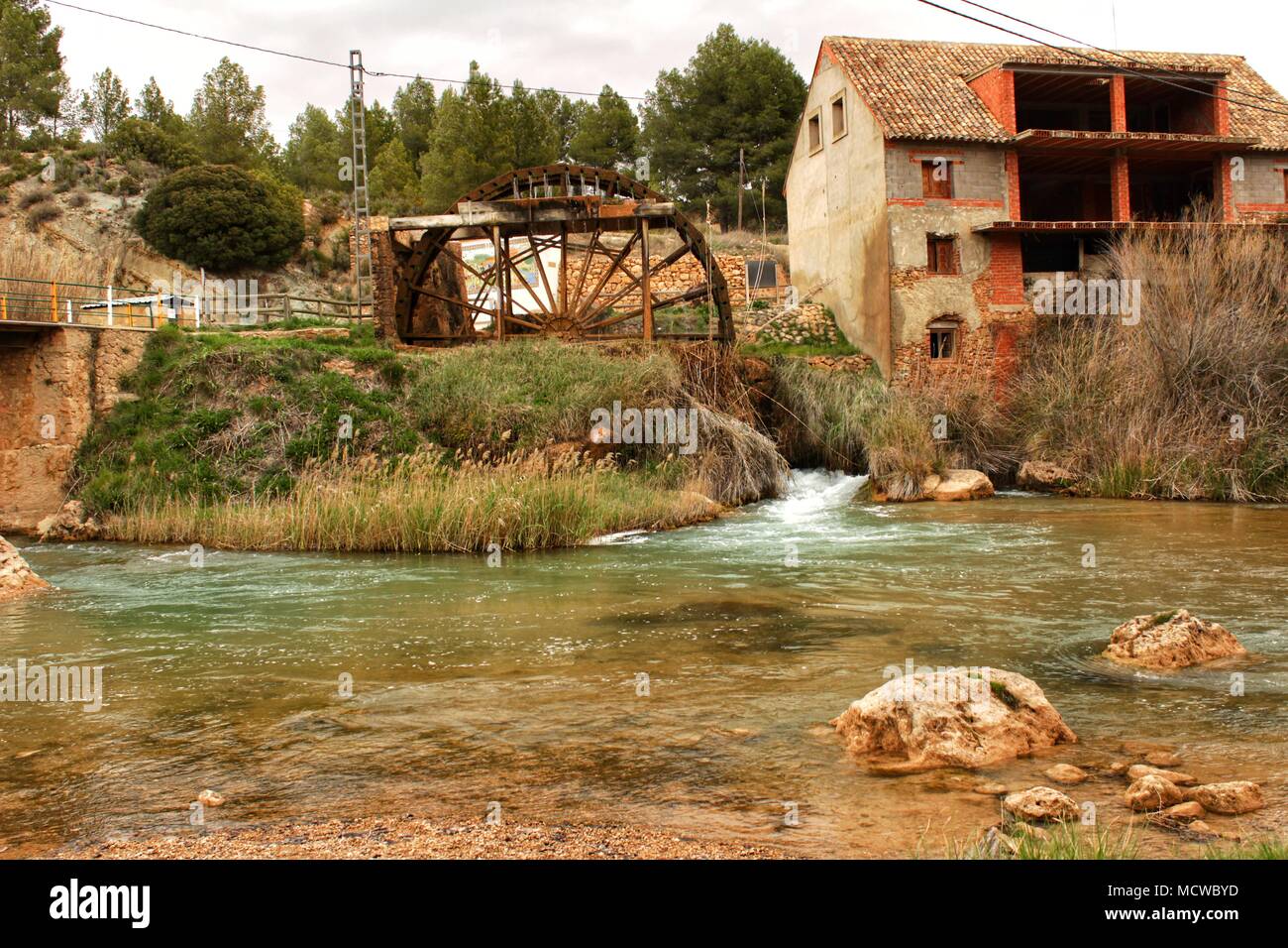 Old wooden Waterwheel and Cabriel River on its way through Casas del ...