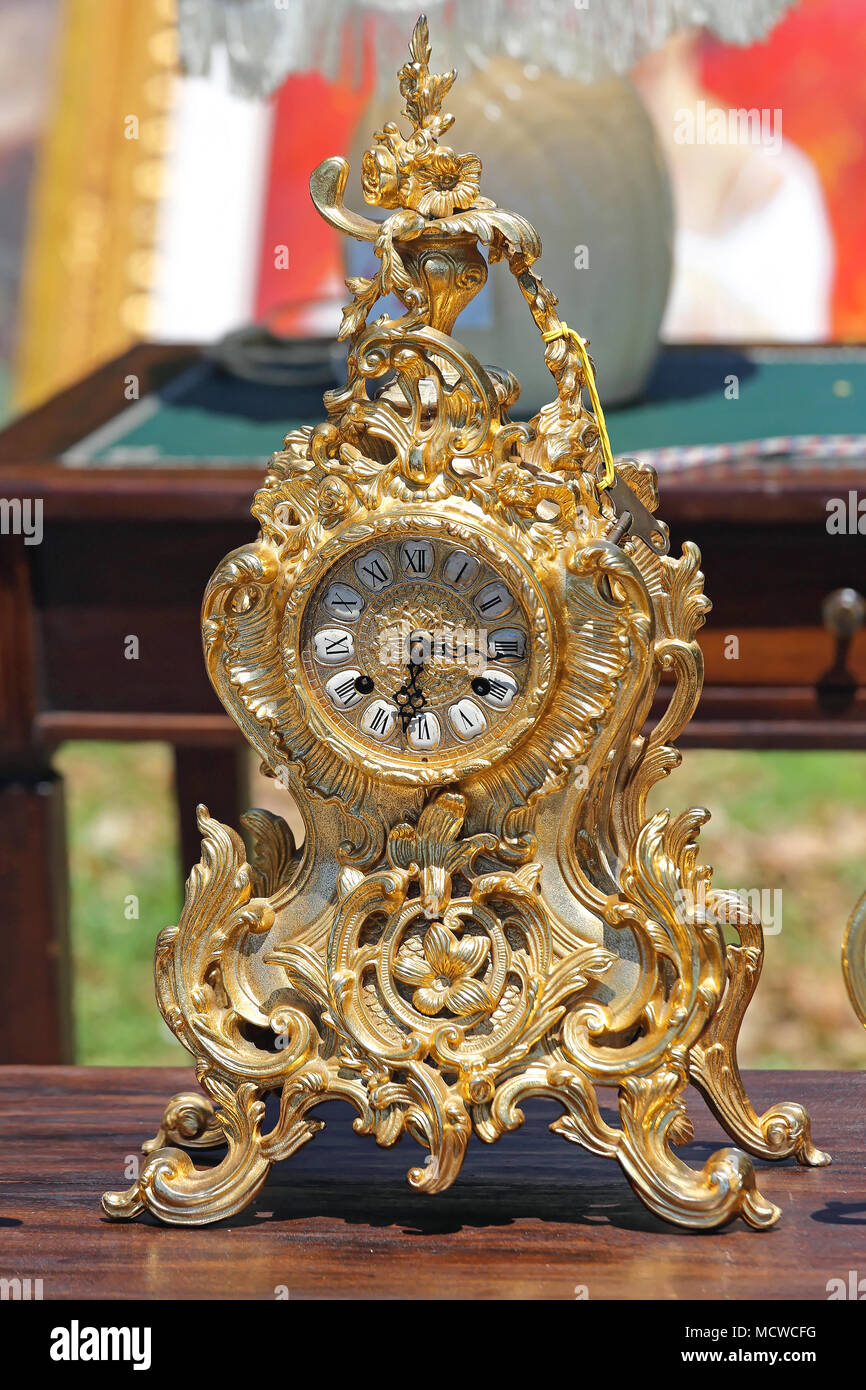 Decorative Ancient Analog Gold Clock at Flea Market Stock Photo - Alamy
