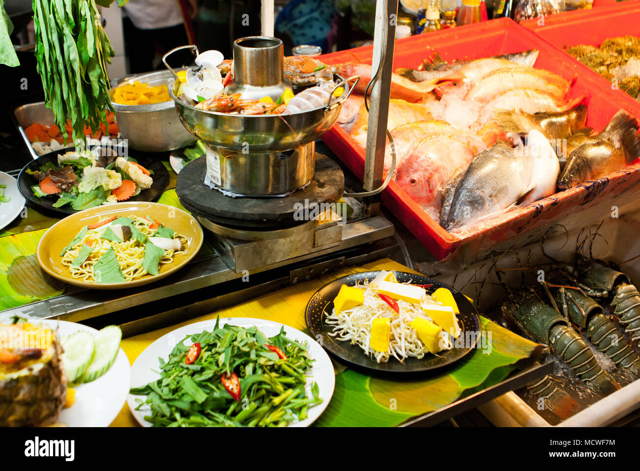 Colored fish at a street food stall at the weekend market, Phuket ...