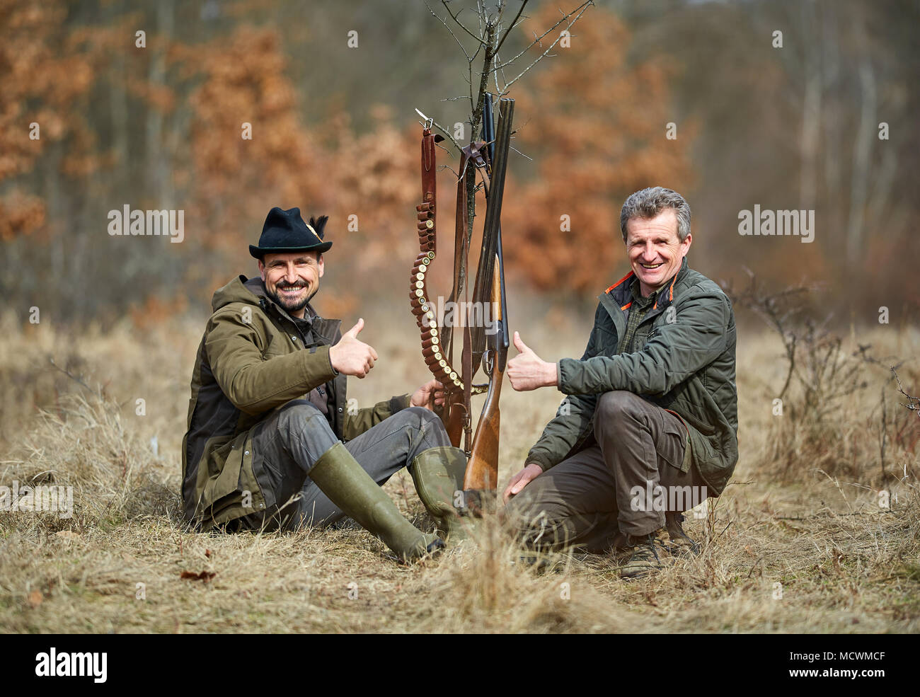 Two hunters together in the forest with double barrel guns Stock Photo ...