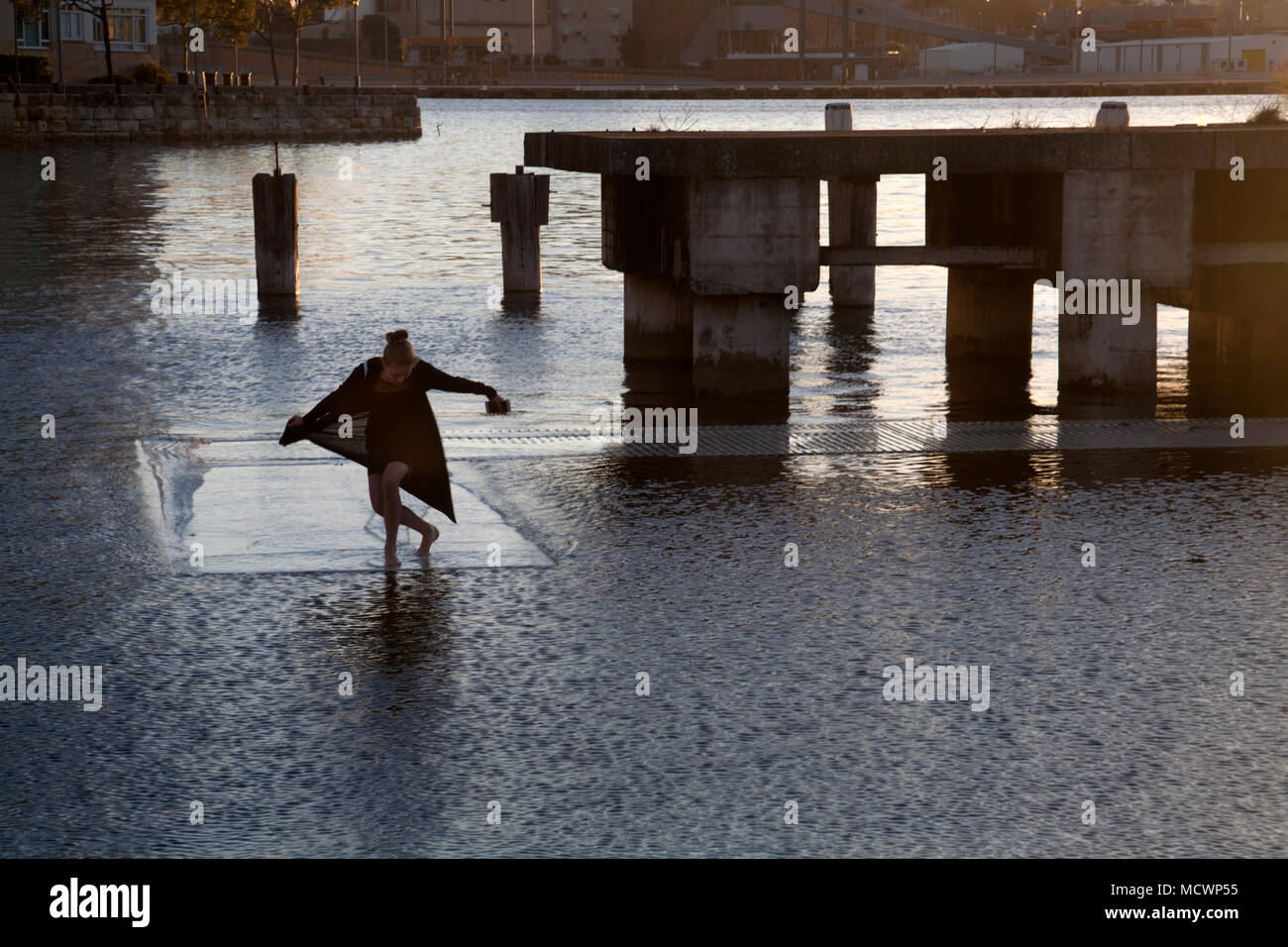 teenage girl walking on water jones bay pyrmont sydney new south wales ...