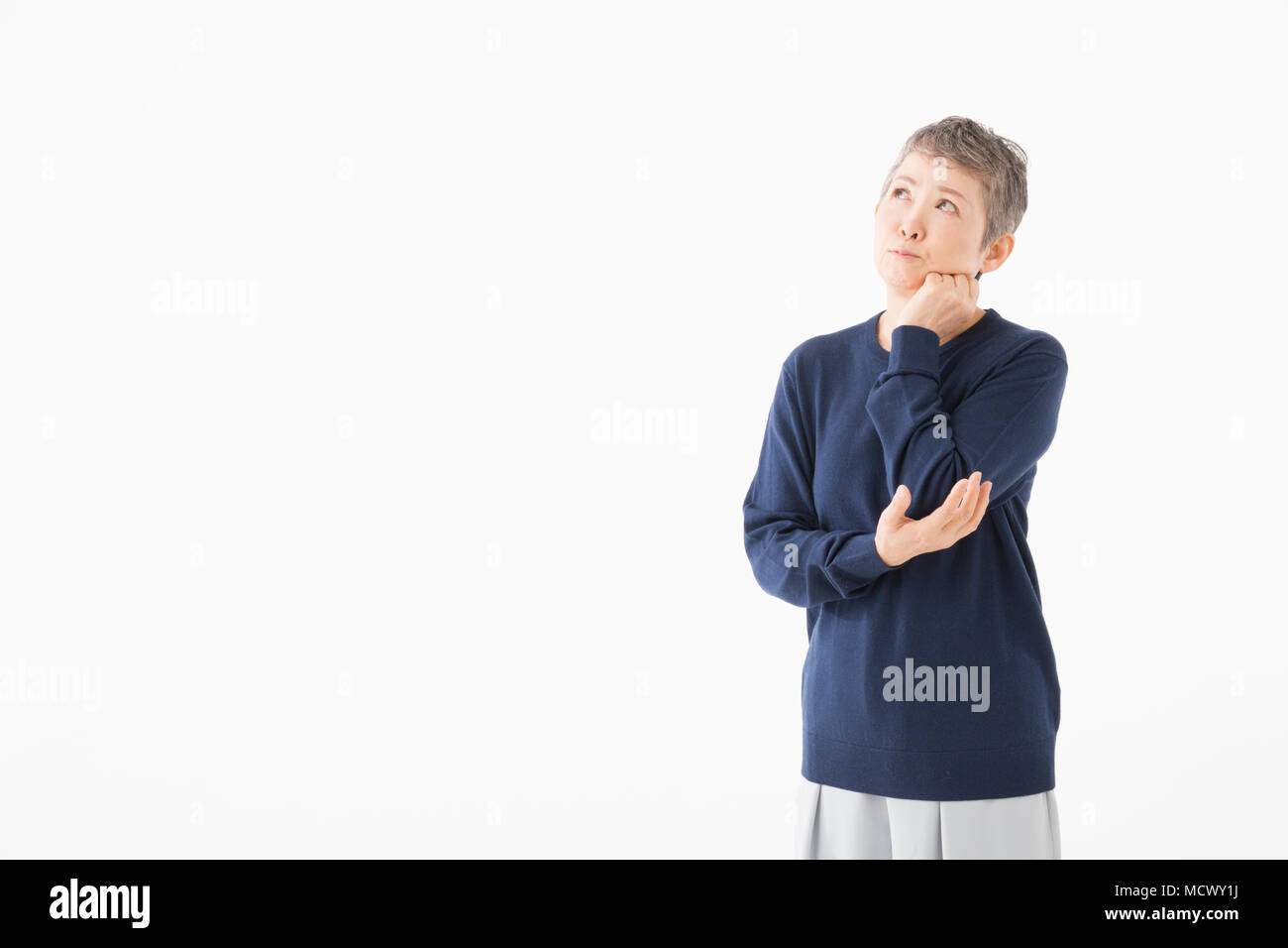 Thinking senior woman Stock Photo - Alamy