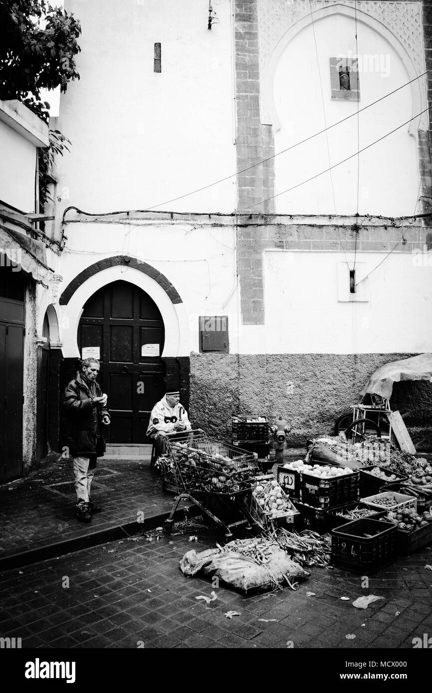 Old fashioned picture of a market stall having vegetables on sale in ...