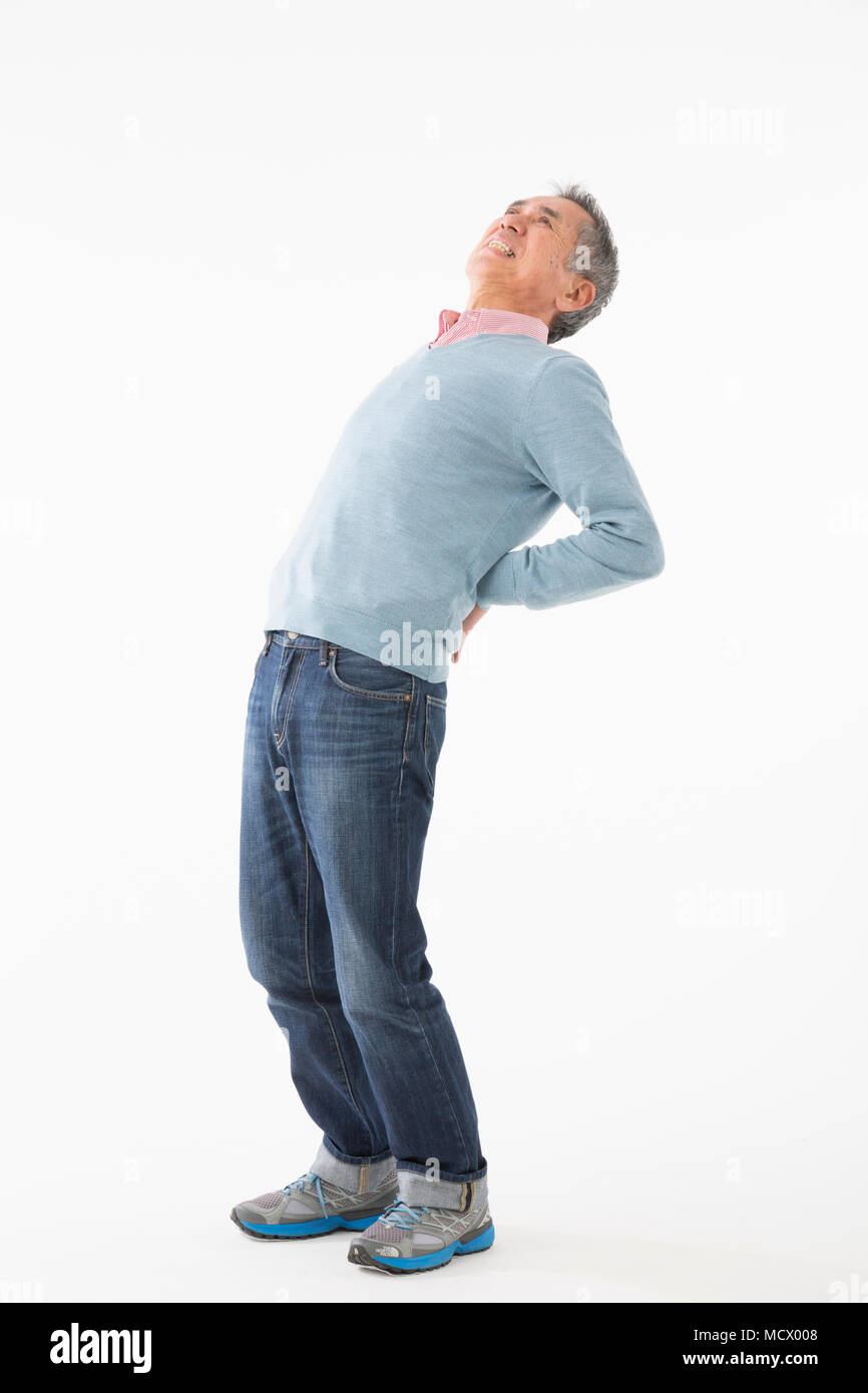 Senior man stratching back Stock Photo - Alamy