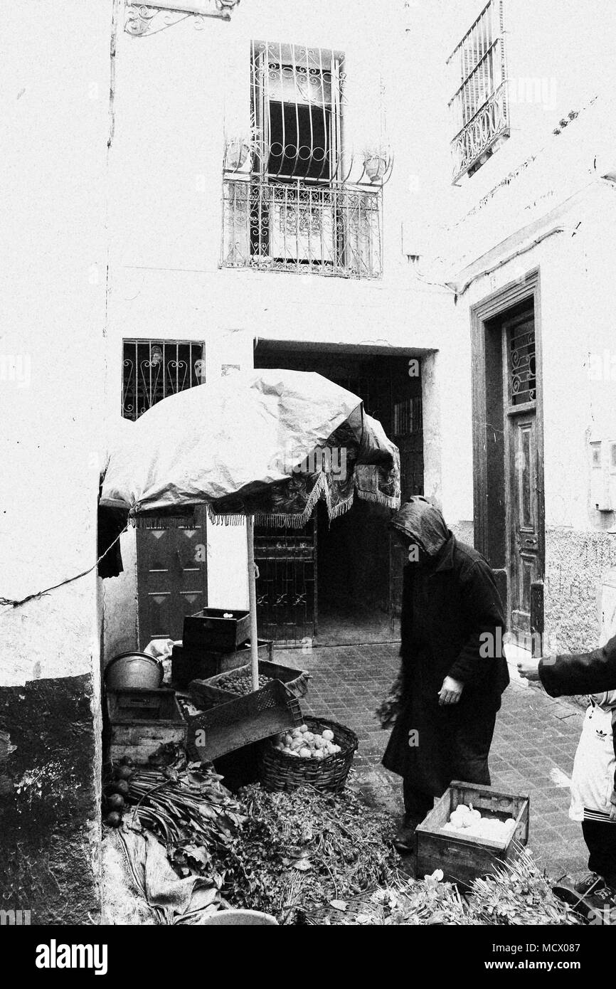 Old fashioned picture of a market stall having vegetables on sale in ...