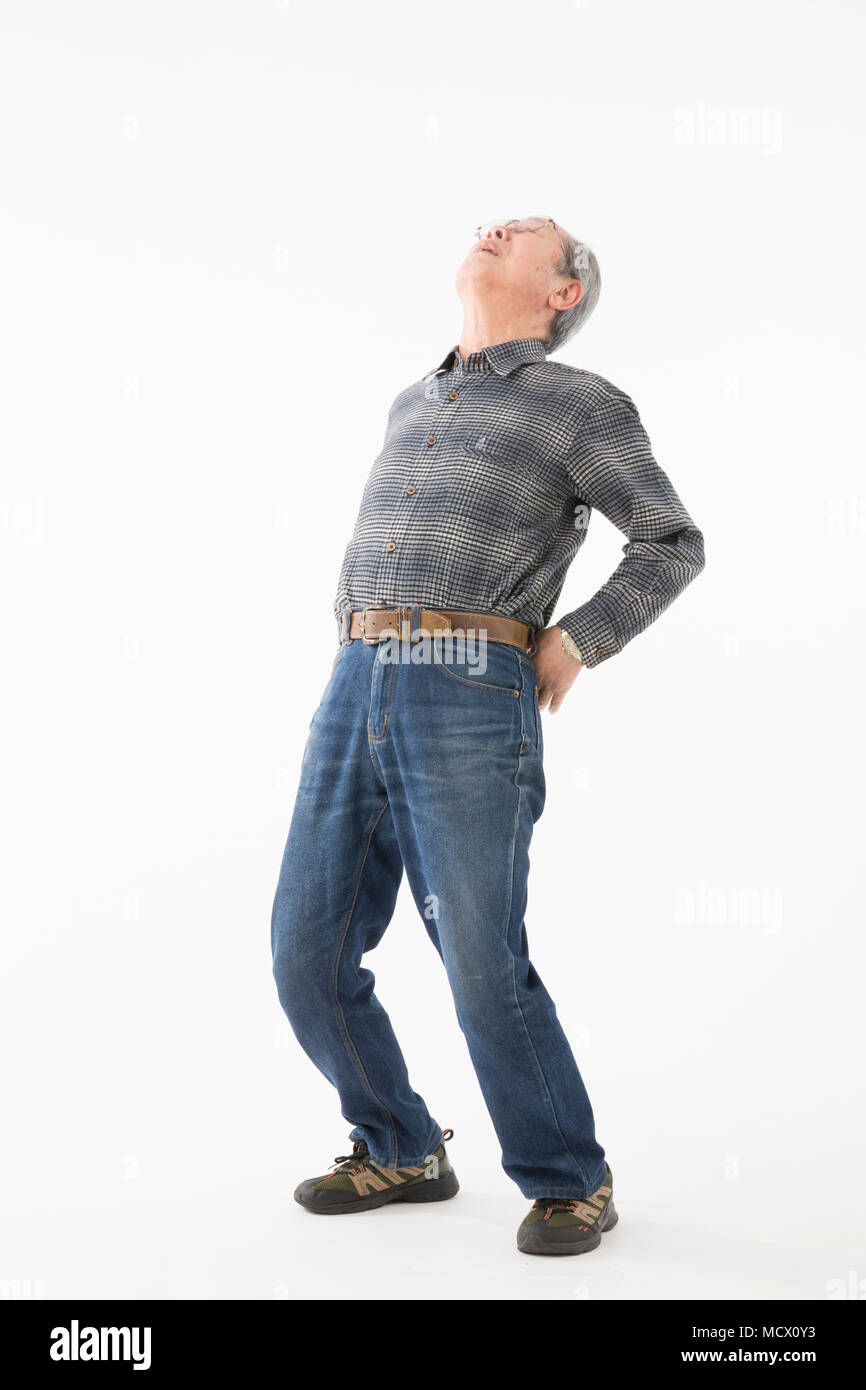 Senior man straching back Stock Photo - Alamy