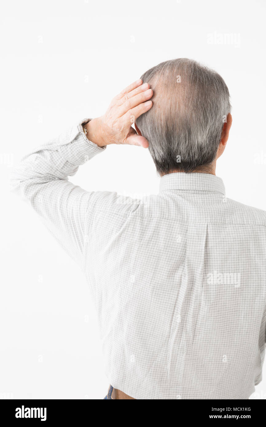 Senior man worried about hair Stock Photo - Alamy