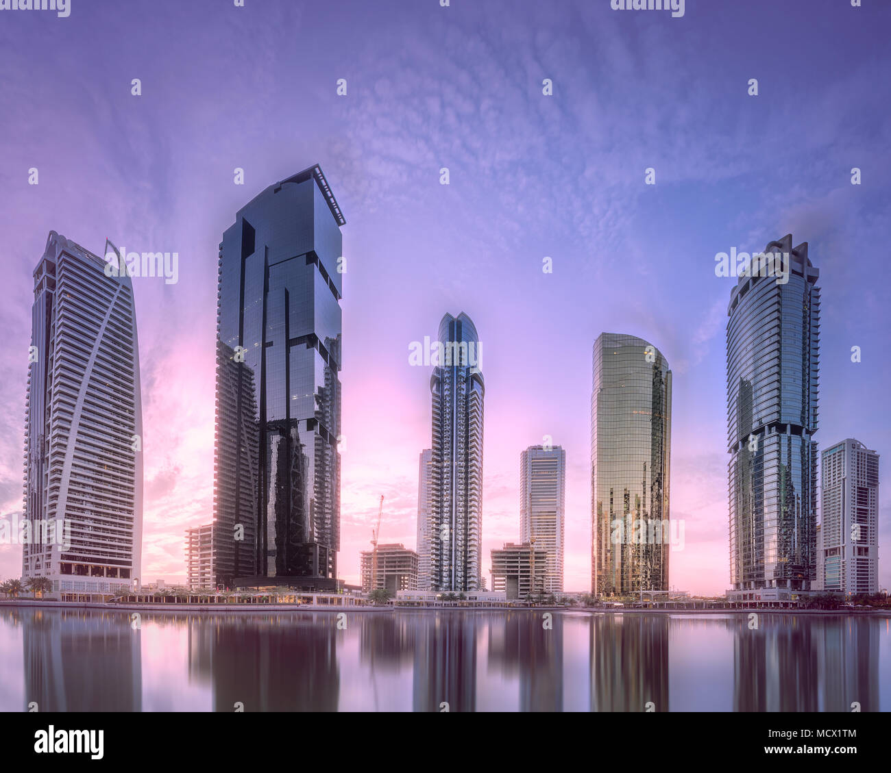 Jumeirah Lakes Towers in Dubai at purple sunrise Stock Photo - Alamy
