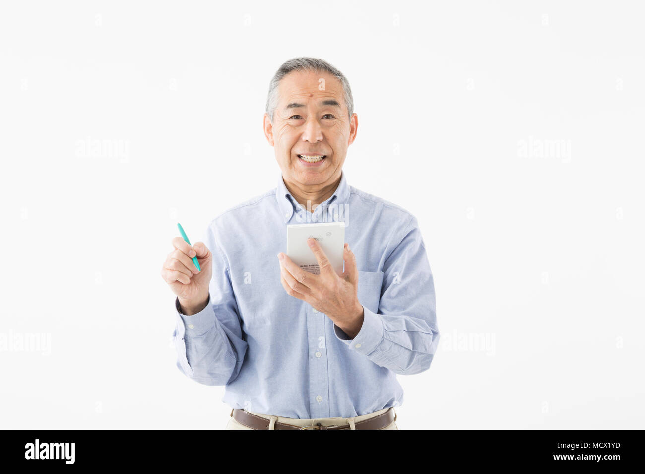 Senior man holding calculator Stock Photo - Alamy
