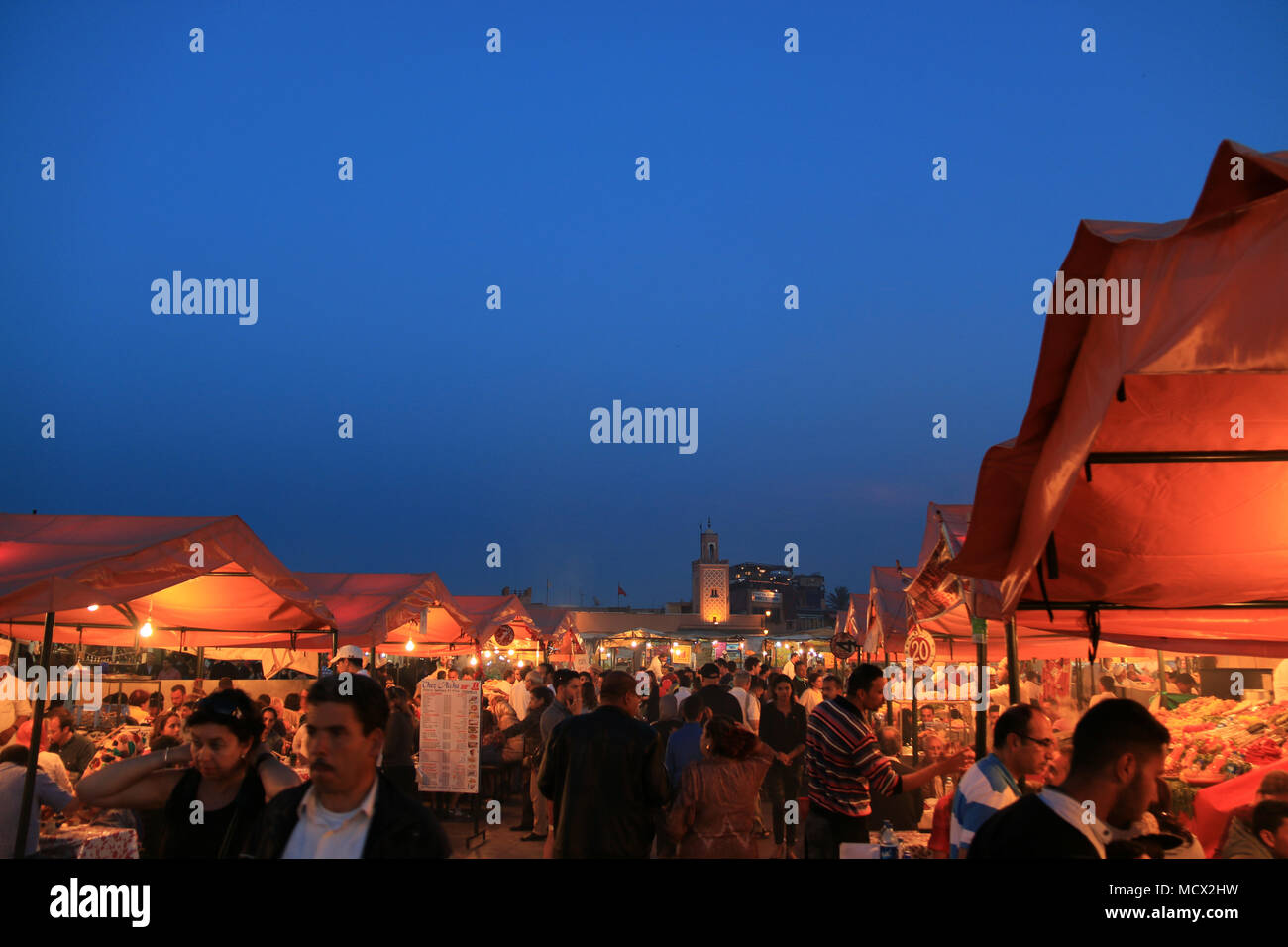 Bustling night life around the street food stalls of the famous Jemaa ...