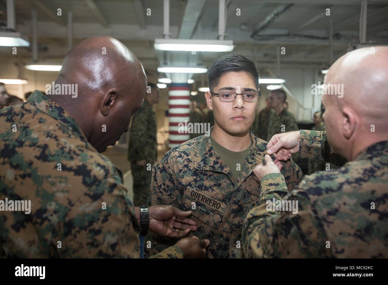 U.S. Marine Corps Lance Cpl. Ezequiel Guerrero, center, a chemical ...