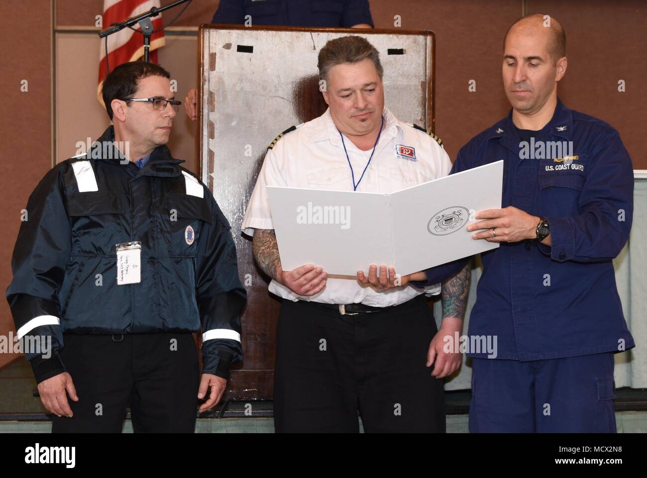 NEW YORK - (From right to left) Capt. Jason Tama, deputy, Coast Guard ...
