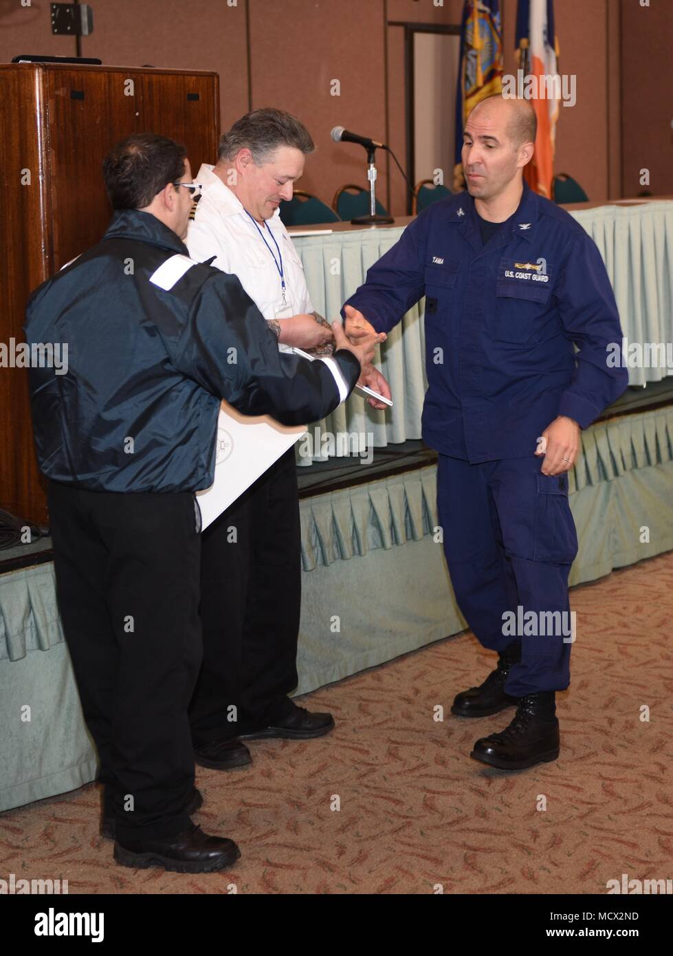 NEW YORK - (From right to left) Capt. Jason Tama, deputy, Coast Guard ...