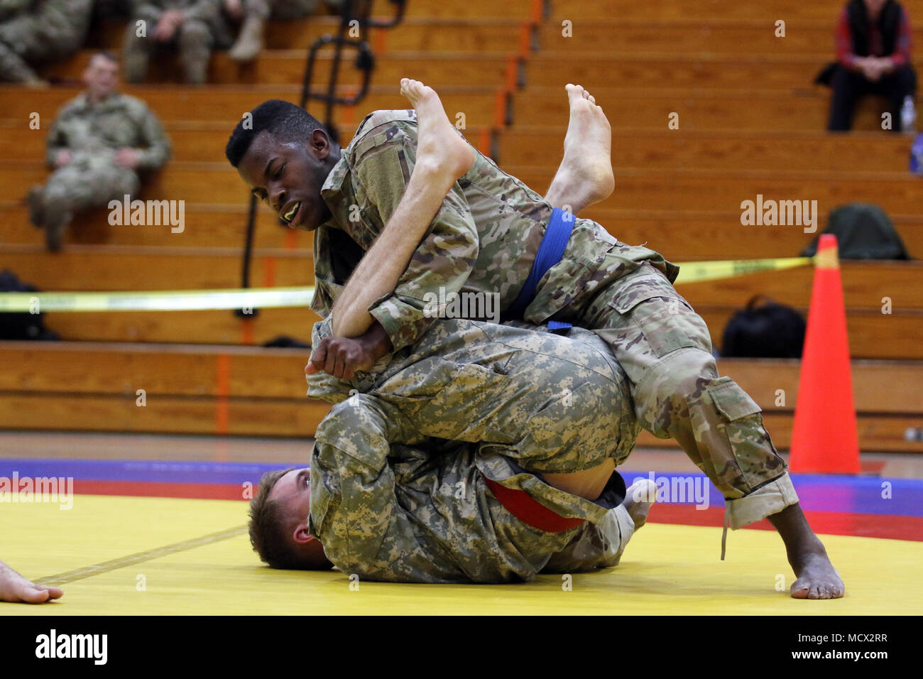 A service member fights for a hold during the Fort Bragg Combatives ...