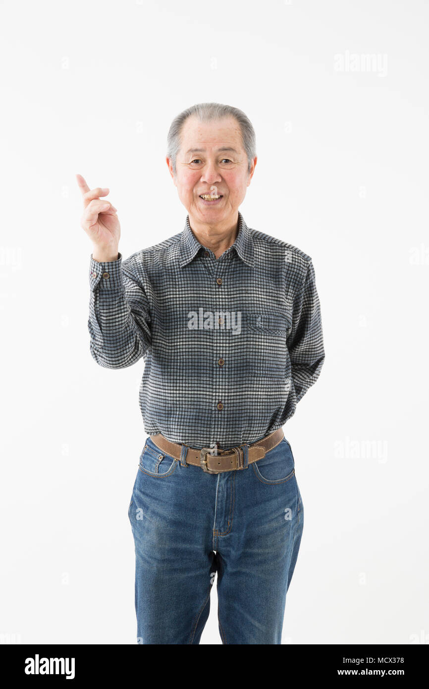 Pointing senior man Stock Photo - Alamy