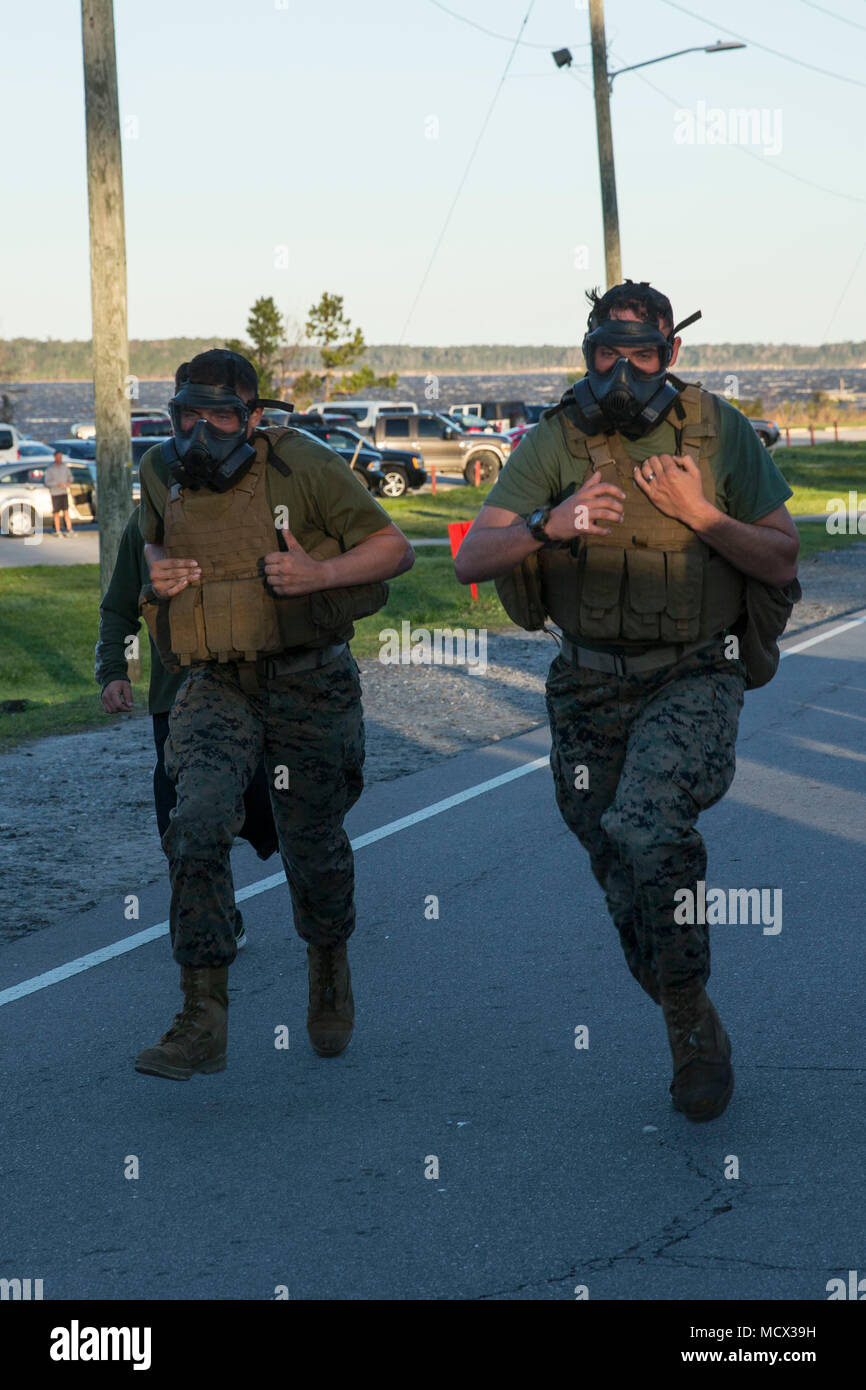 U.S. Marines with 10th Marine Regiment, 2nd Marine Division run during ...