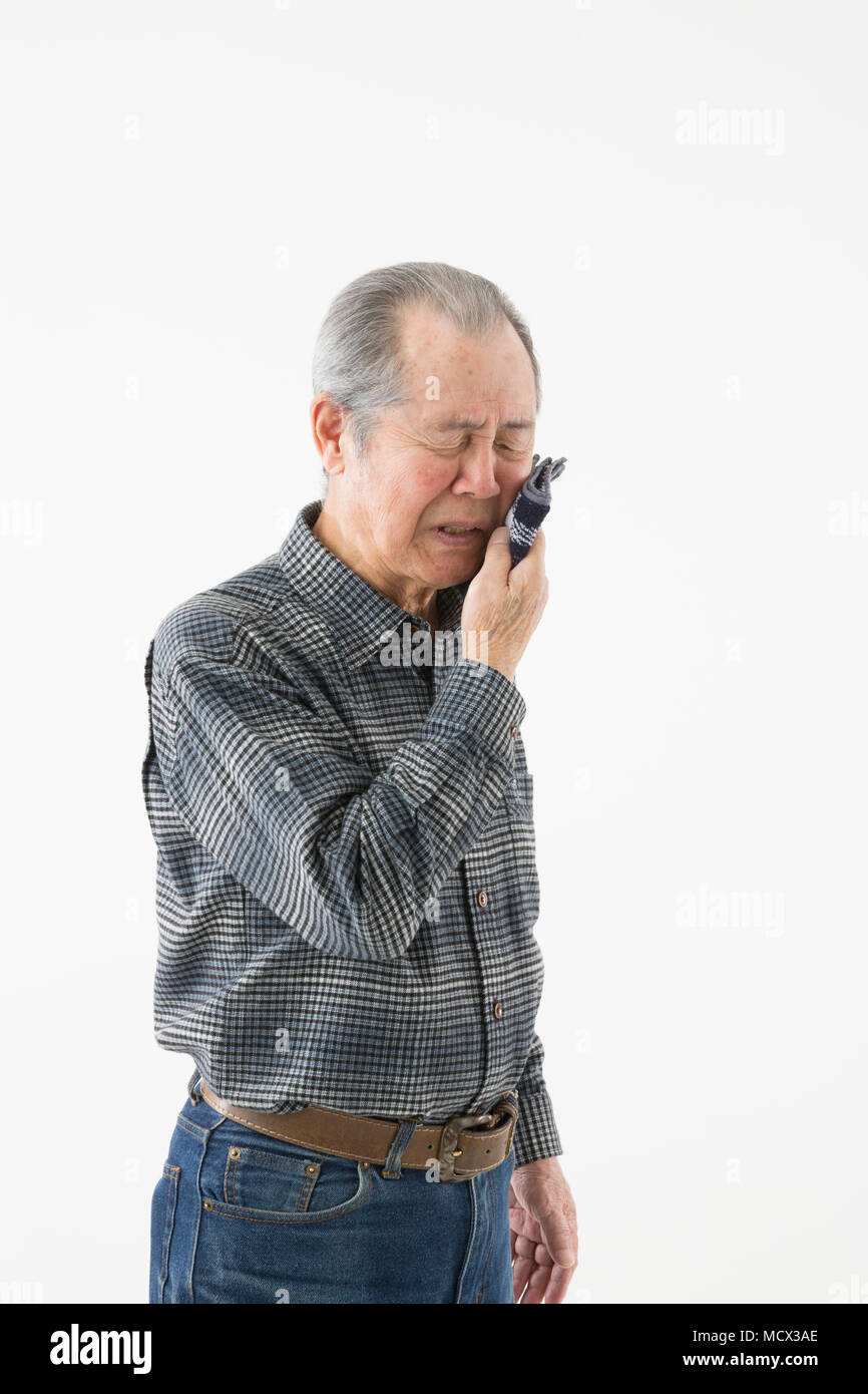 Senior man wiping off sweat Stock Photo - Alamy