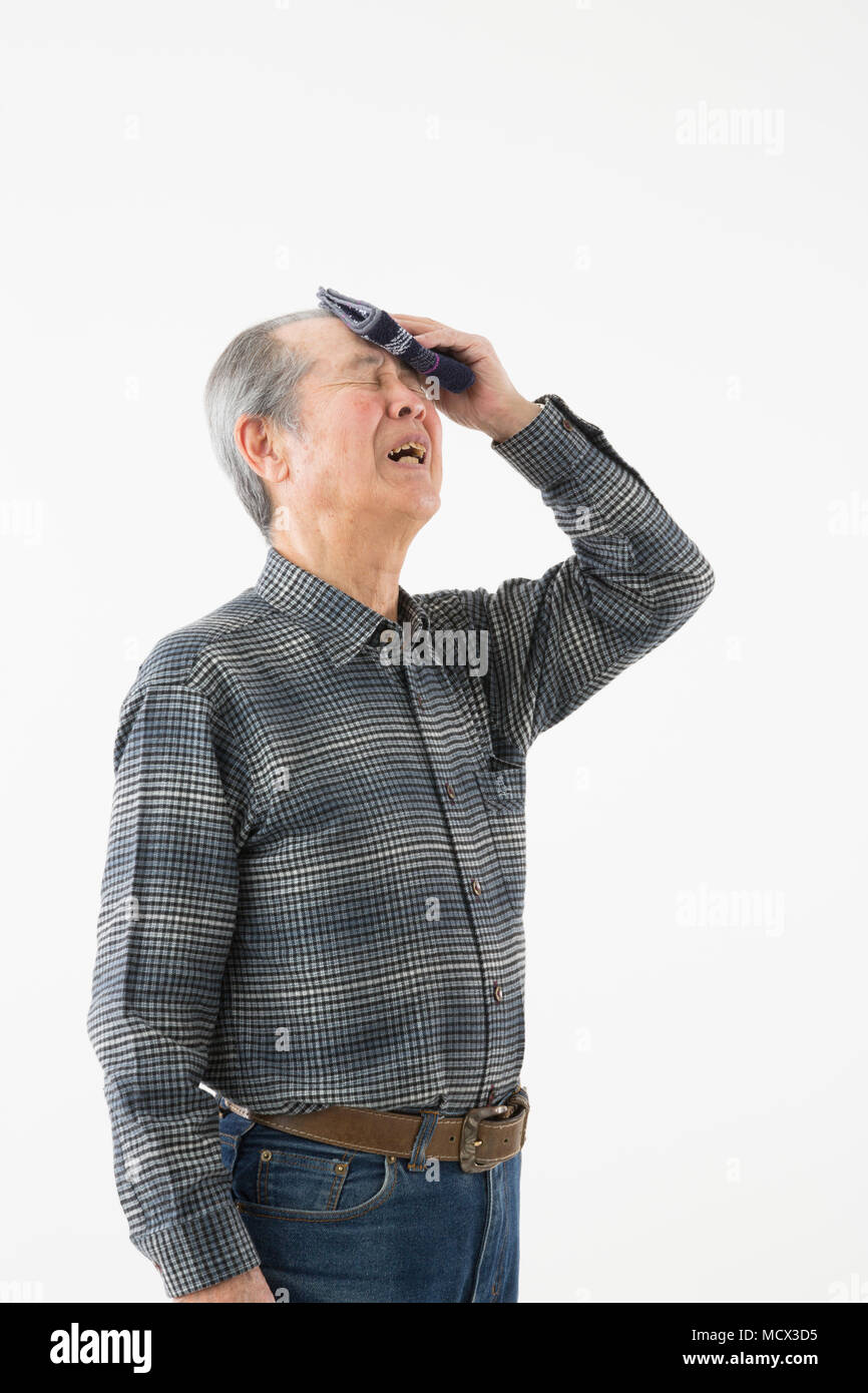 Man wiping sweat hi-res stock photography and images - Alamy