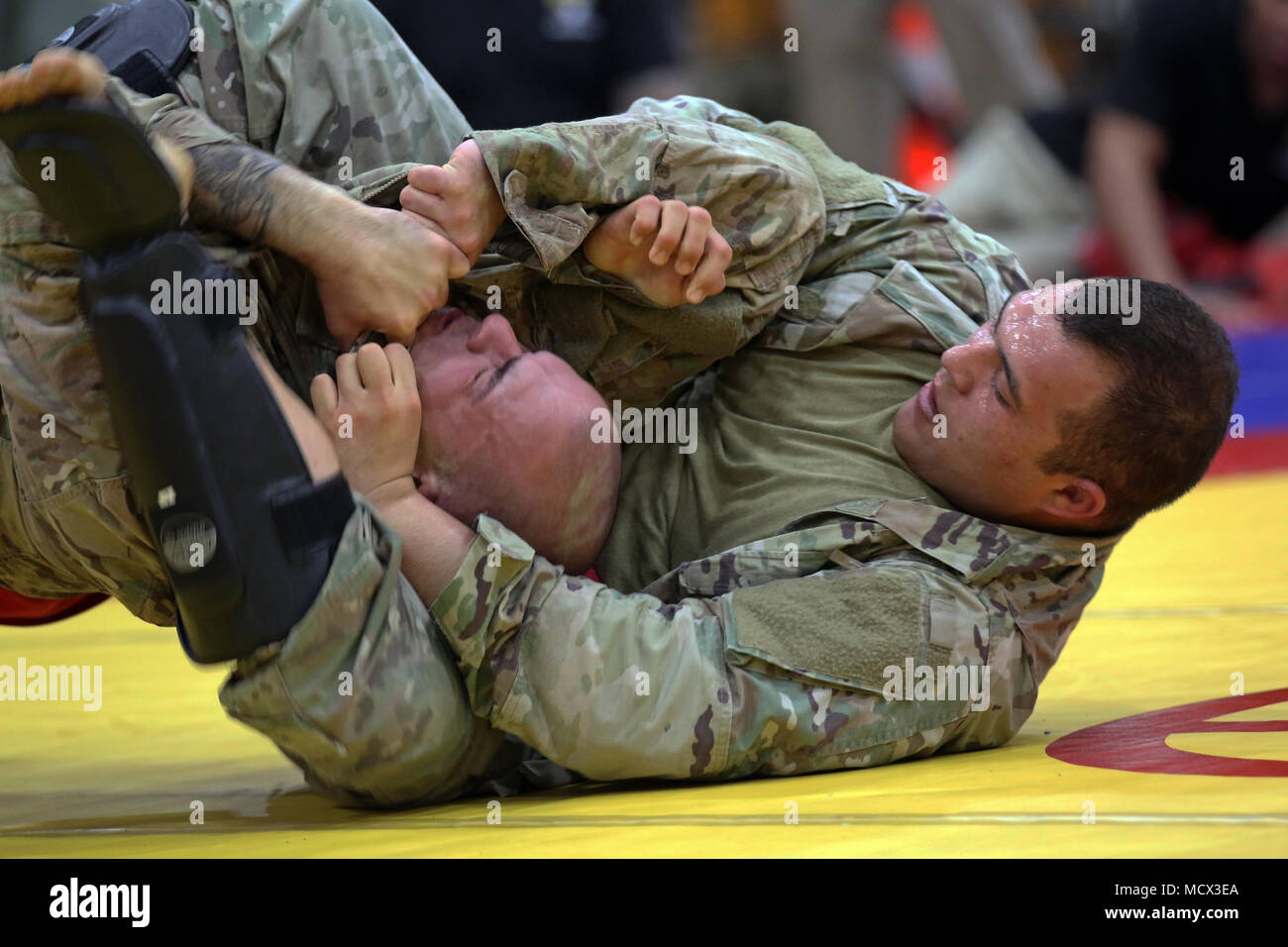 A service member puts his opponent in a hold during the Fort Bragg ...