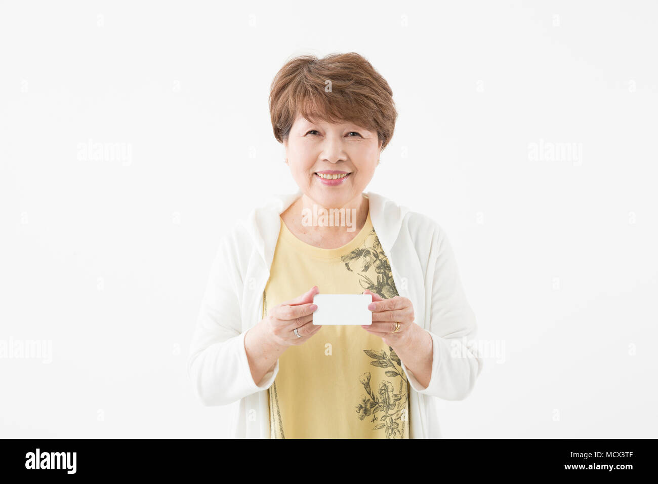 Senior woman showing ID Stock Photo - Alamy