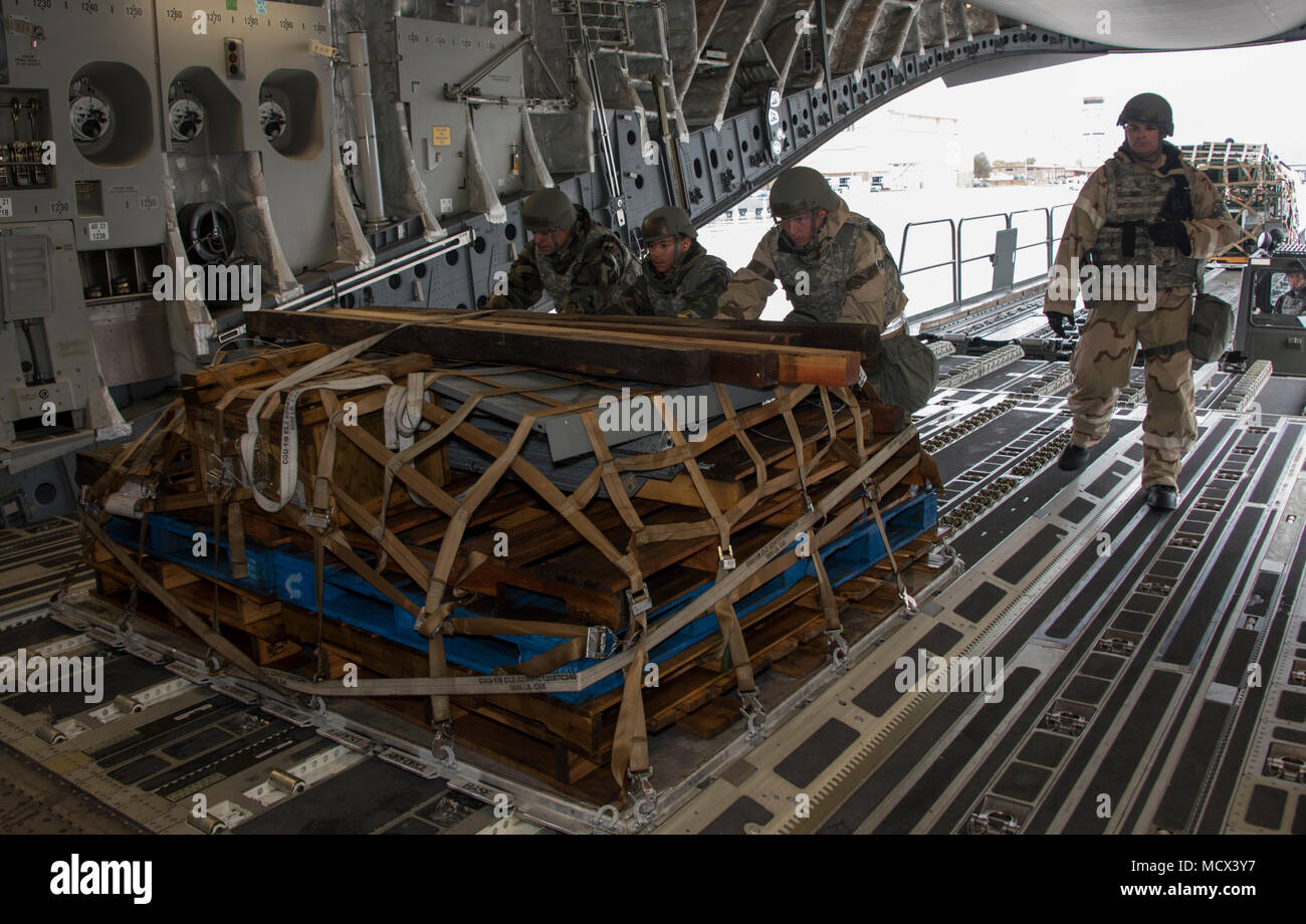 Cargo pallets are loaded onto a C-17 Globemaster III, March 1, 2018 ...