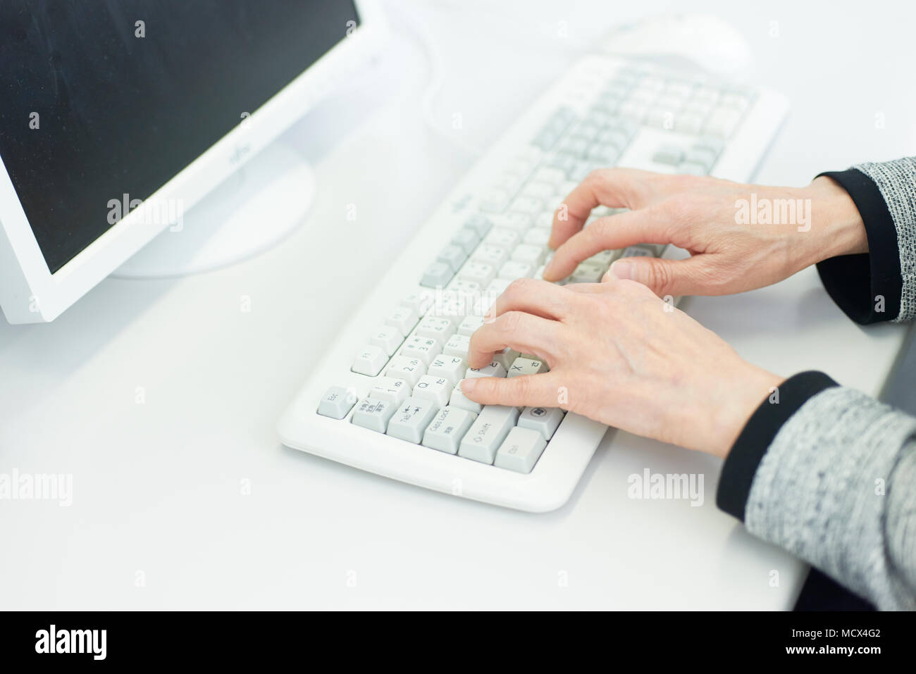 Hands typing keyboard Stock Photo - Alamy