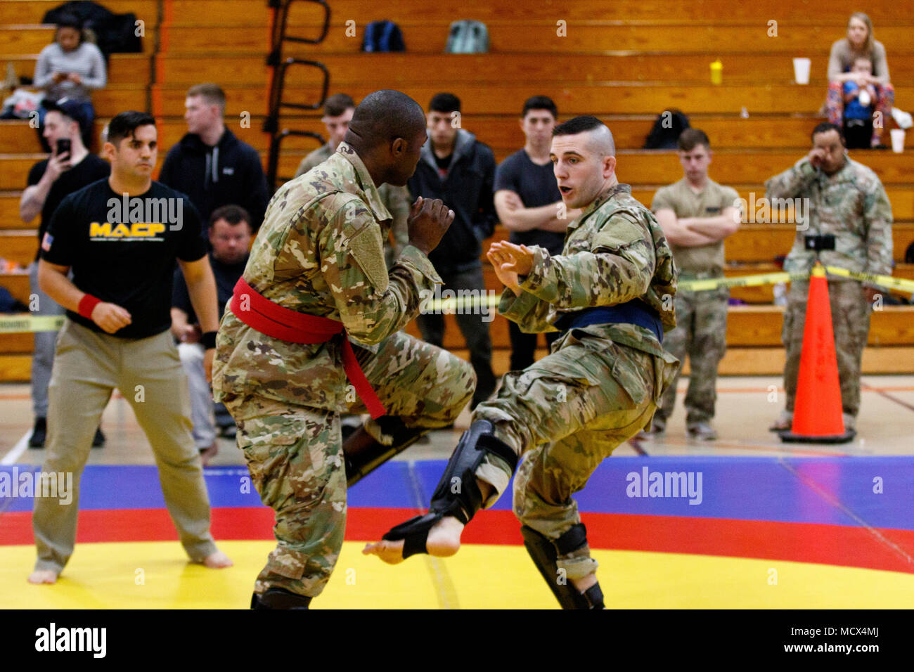 Wearing the blue belt, U.S. Army Pvt. Todd Bevan assigned with 7th ...
