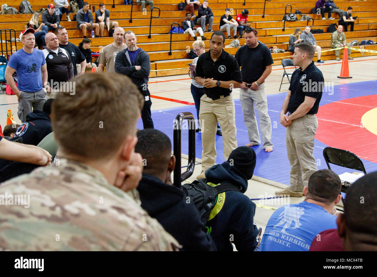 U.S. Army Combatives School instructors, give instructions of the rules ...