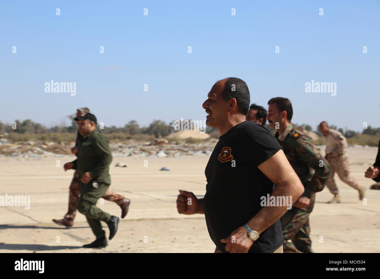 Iraqi soldiers with the Desert Battalion, Iraqi Army, start the half ...