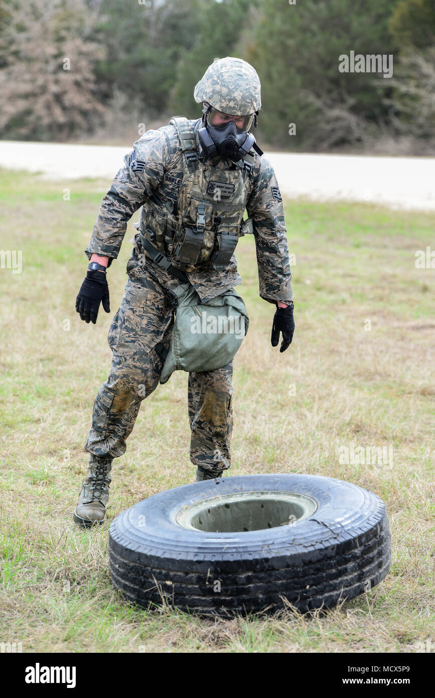 Staff Sgt. Jeremy Dawley, member of the 147th Attack Wing, flips a tire ...