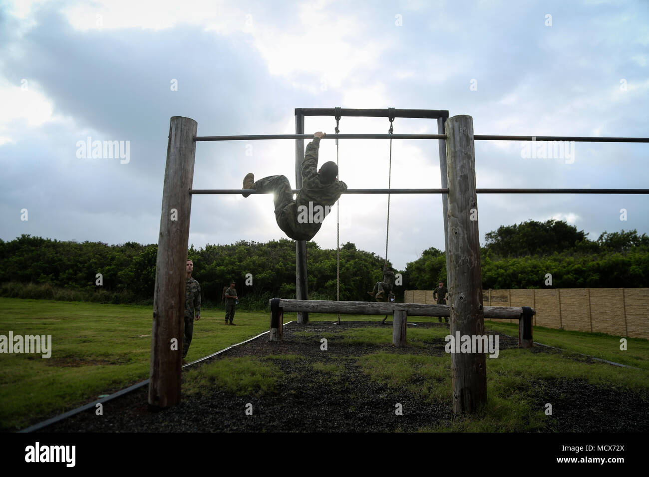 A U.S. Marine runs through the obstacle course on Marine Corps Base ...
