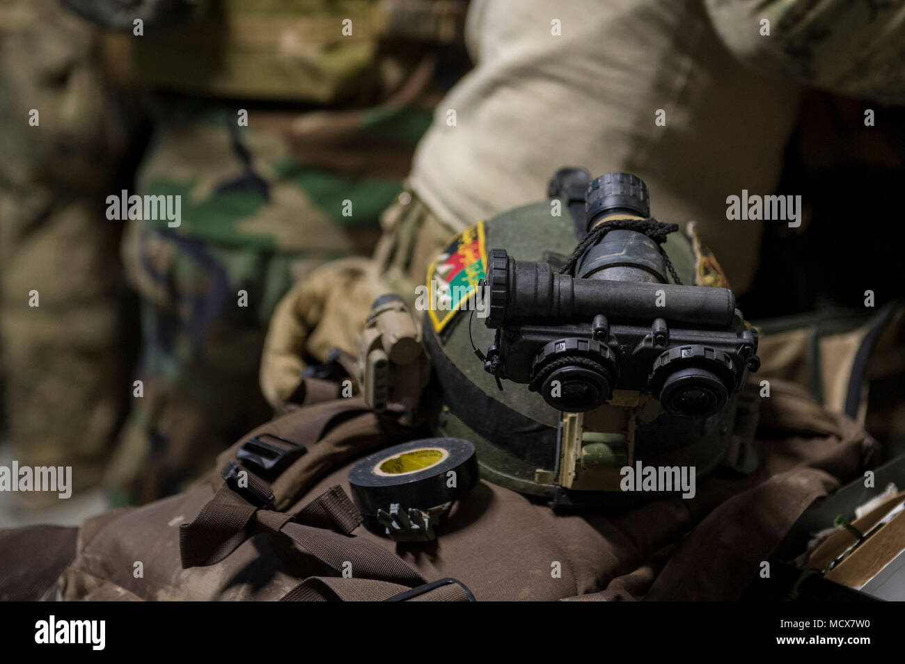 An Afghan National Mission Brigade special operator prepares his M4 ...