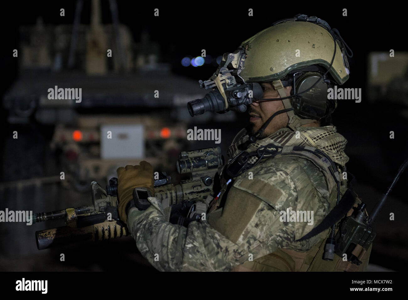 An Afghan National Mission Brigade special operator prepares his M4 ...