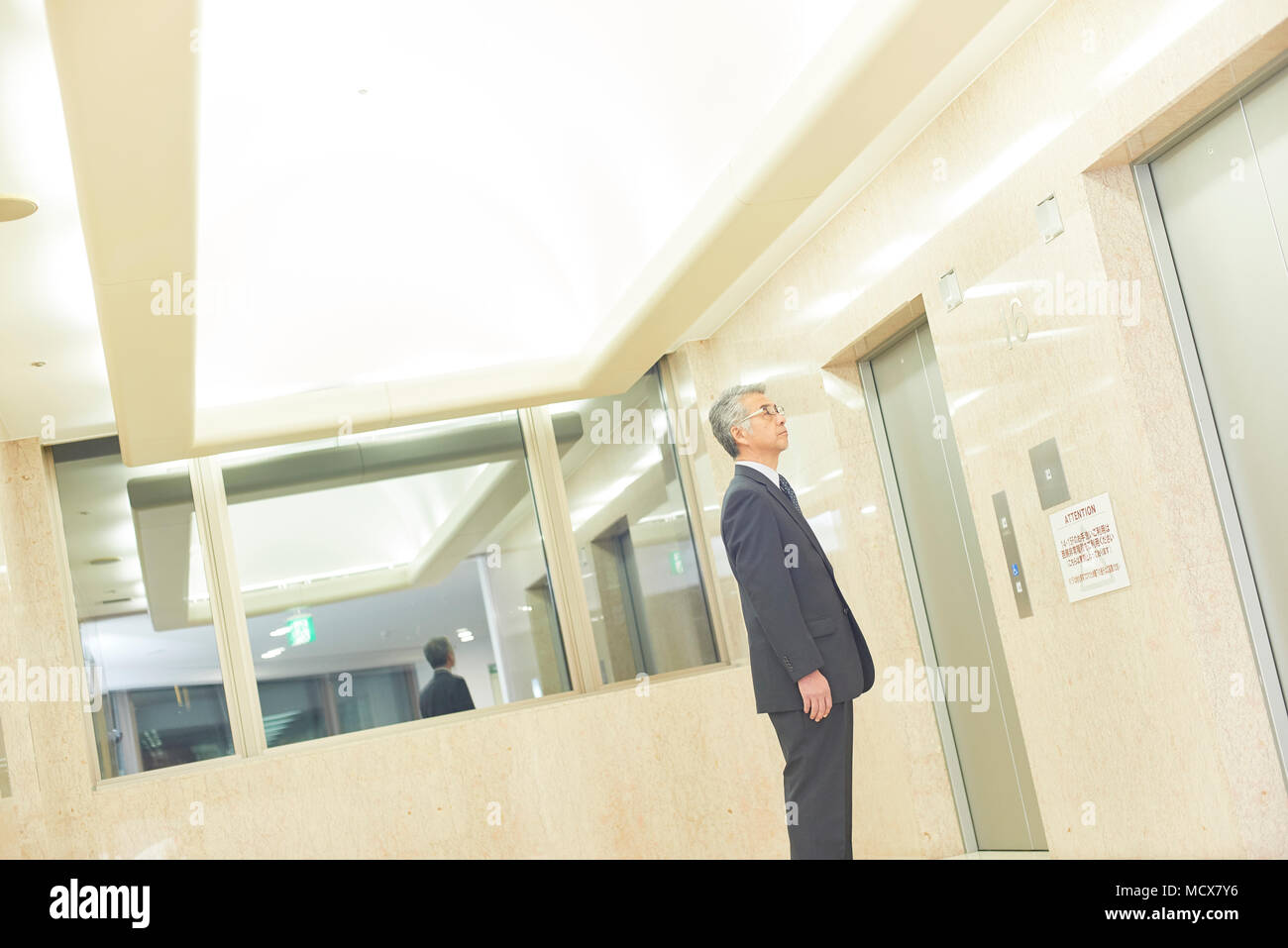 Waiting for lift hi-res stock photography and images - Alamy