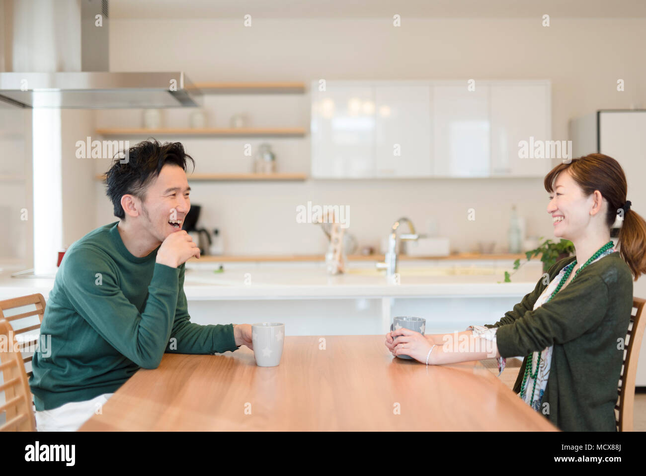 Talking married couple Stock Photo - Alamy