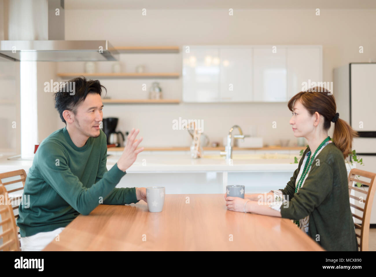 Talking married couple Stock Photo - Alamy