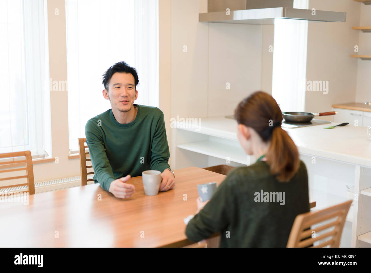 Talking married couple Stock Photo - Alamy