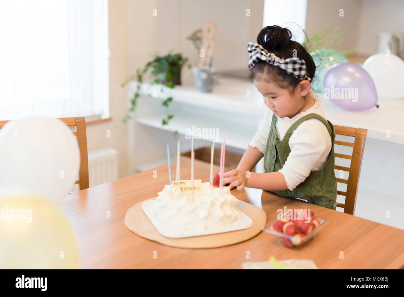 Girl making a cake Stock Photo - Alamy